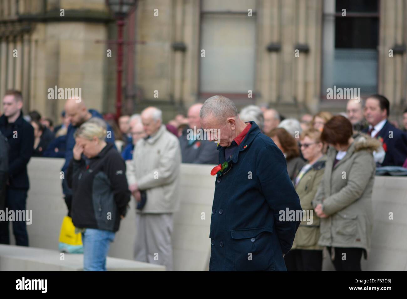 Manchester, UK 11th November 2015 A man bows his head during the two ...