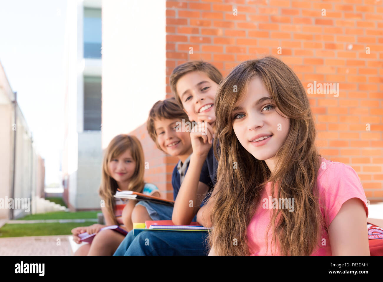 Group of happy little school kids in school Stock Photo - Alamy