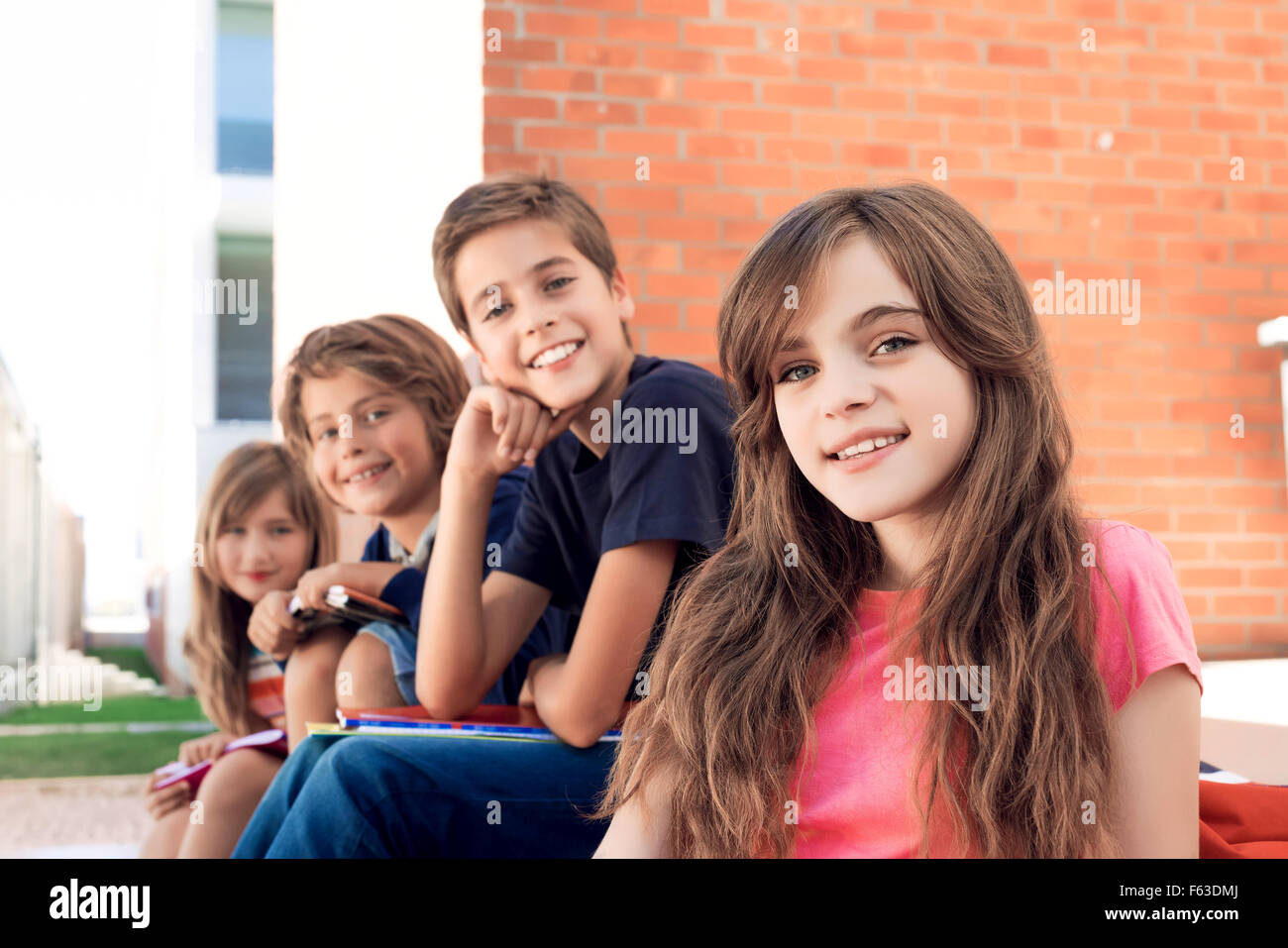 Group of happy little school kids in school Stock Photo - Alamy