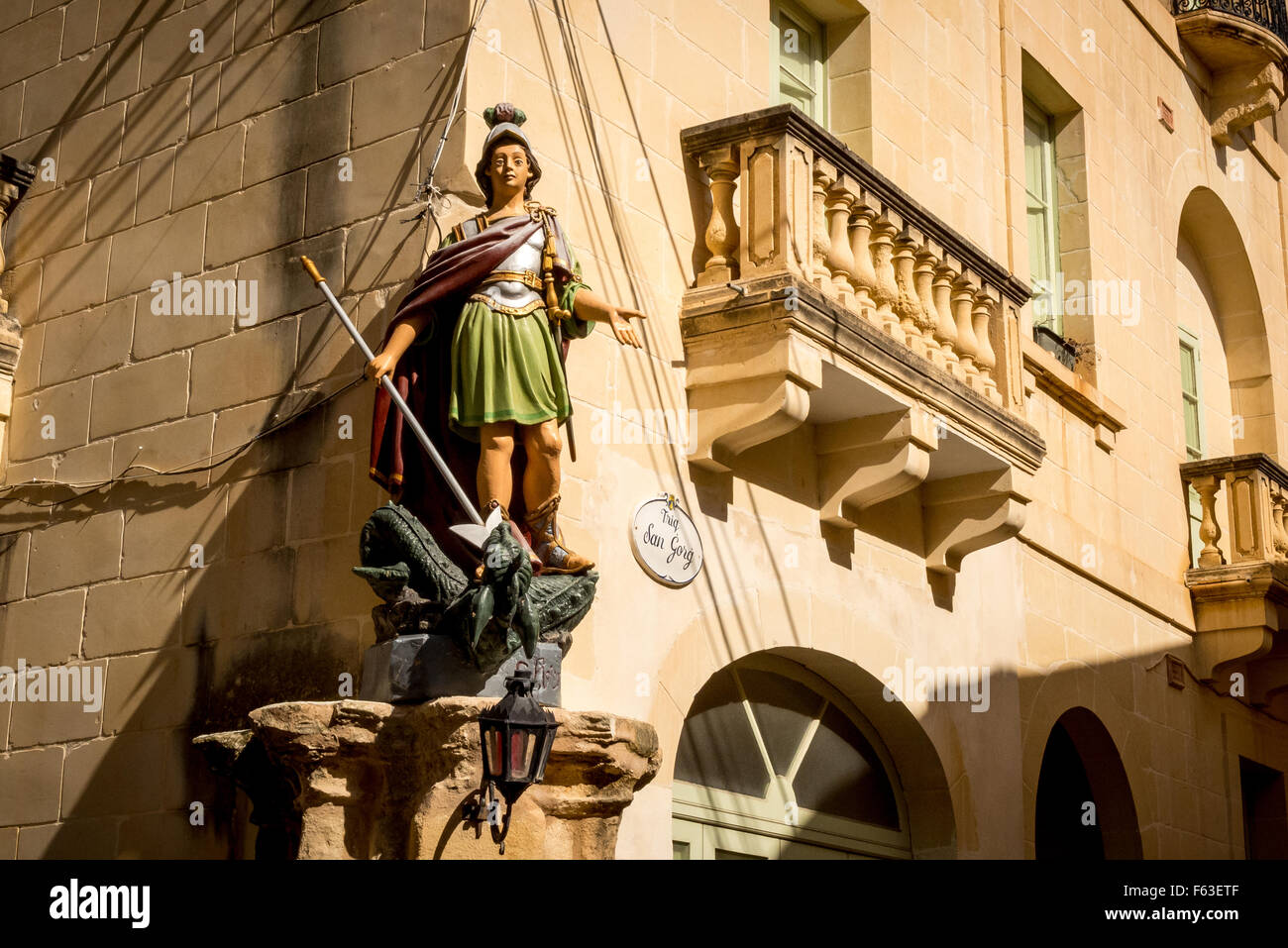 Statue of St George slaying the dragon on a street corner in Victoria ...