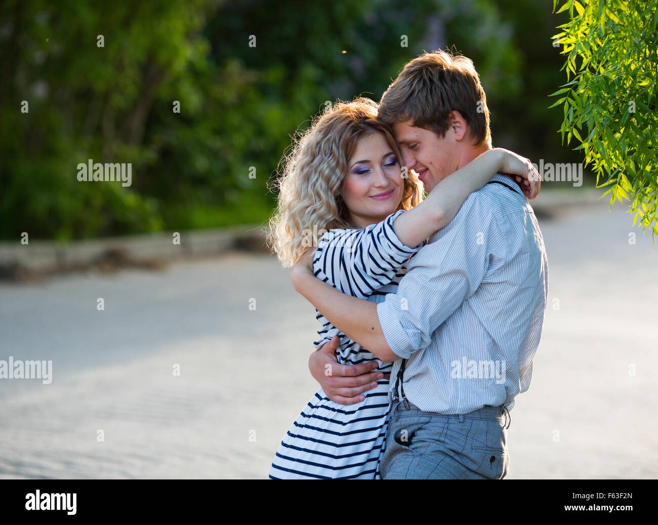 Two lovers in the park Stock Photo - Alamy