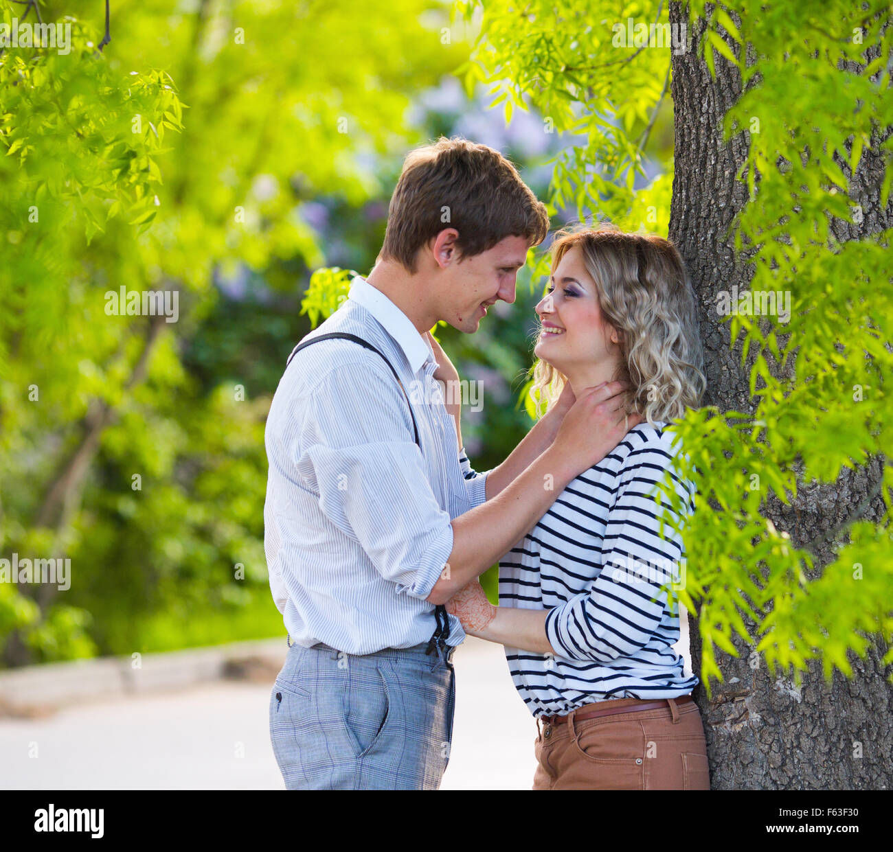 Two lovers in the park Stock Photo - Alamy