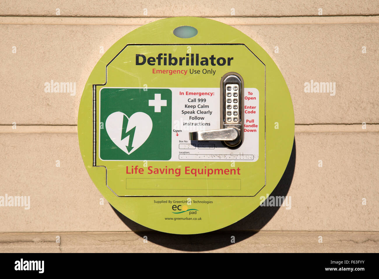 A defibrillator on a wall in a large town Stock Photo - Alamy