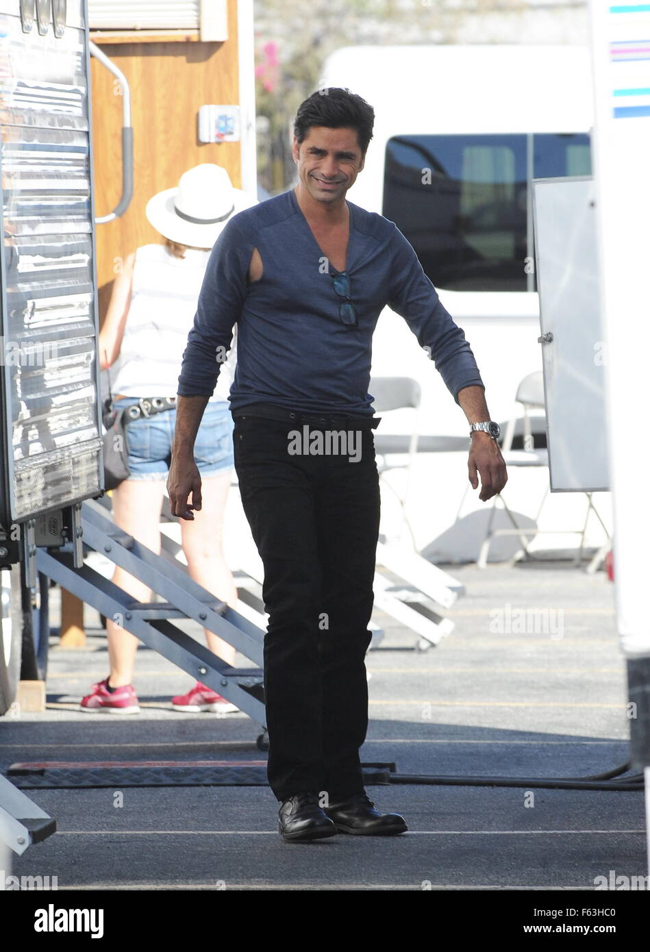 Actor John Stamos spotted with ripped up shirt on the set of ...
