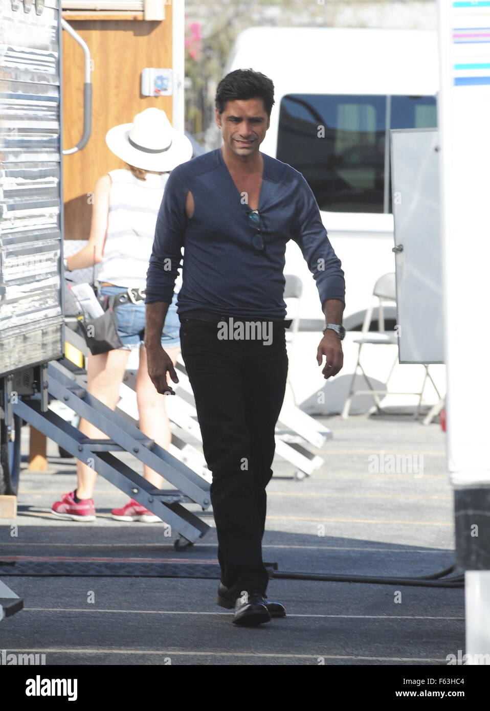 Actor John Stamos spotted with ripped up shirt on the set of ...