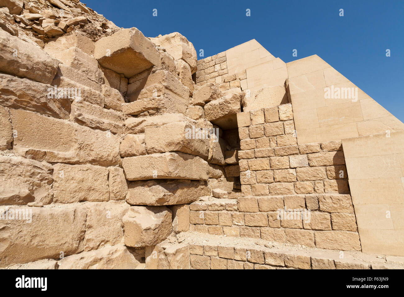 Reconstructed masonry and casing Pyramid of Unas, western corner, at ...