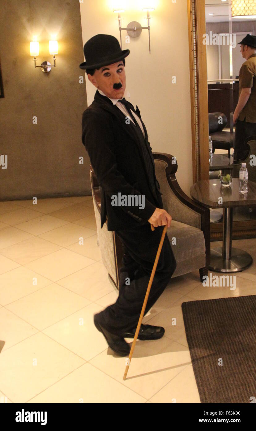 A lookalike of Charlie Chaplin poses for pictures in Beverly Hills ...