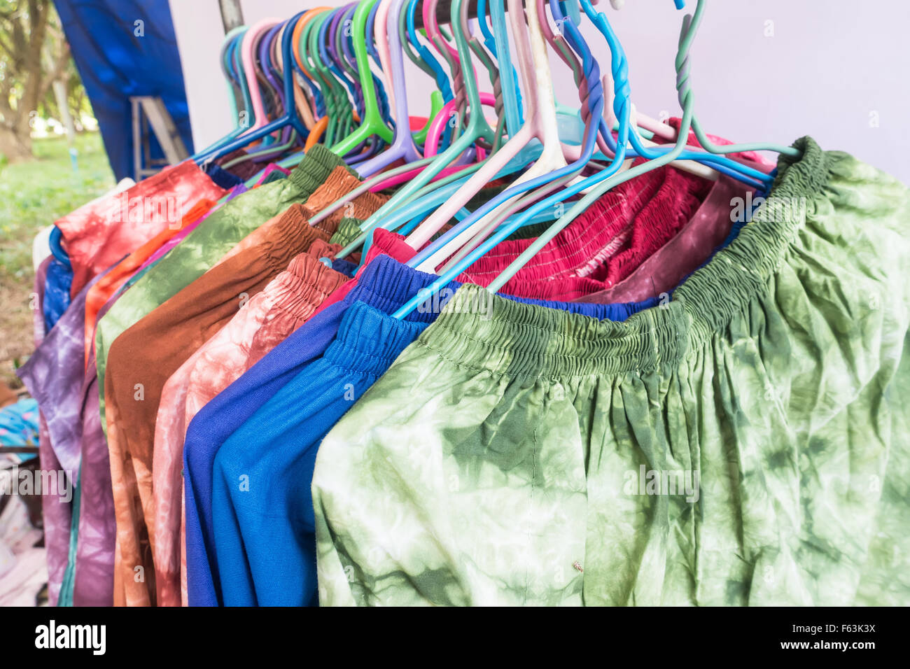 Clothes on hangers in a clothes shop Stock Photo - Alamy