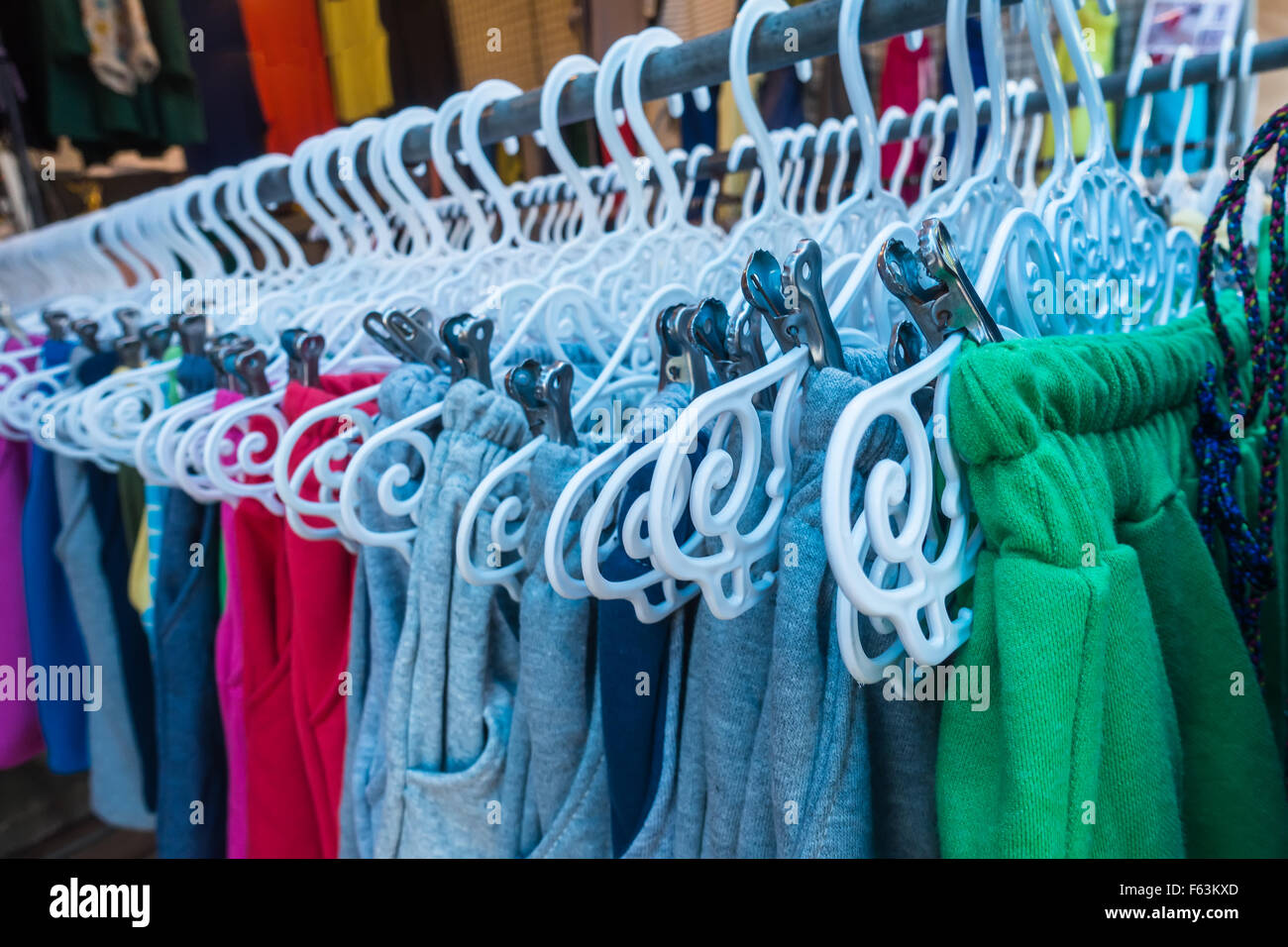 Clothes on hangers in a clothes shop Stock Photo - Alamy