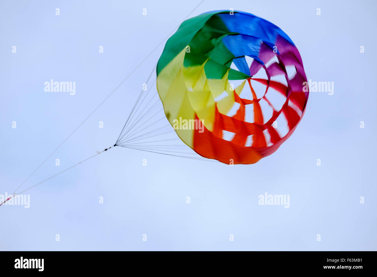 Colourful kite blowing in the wind Stock Photo - Alamy
