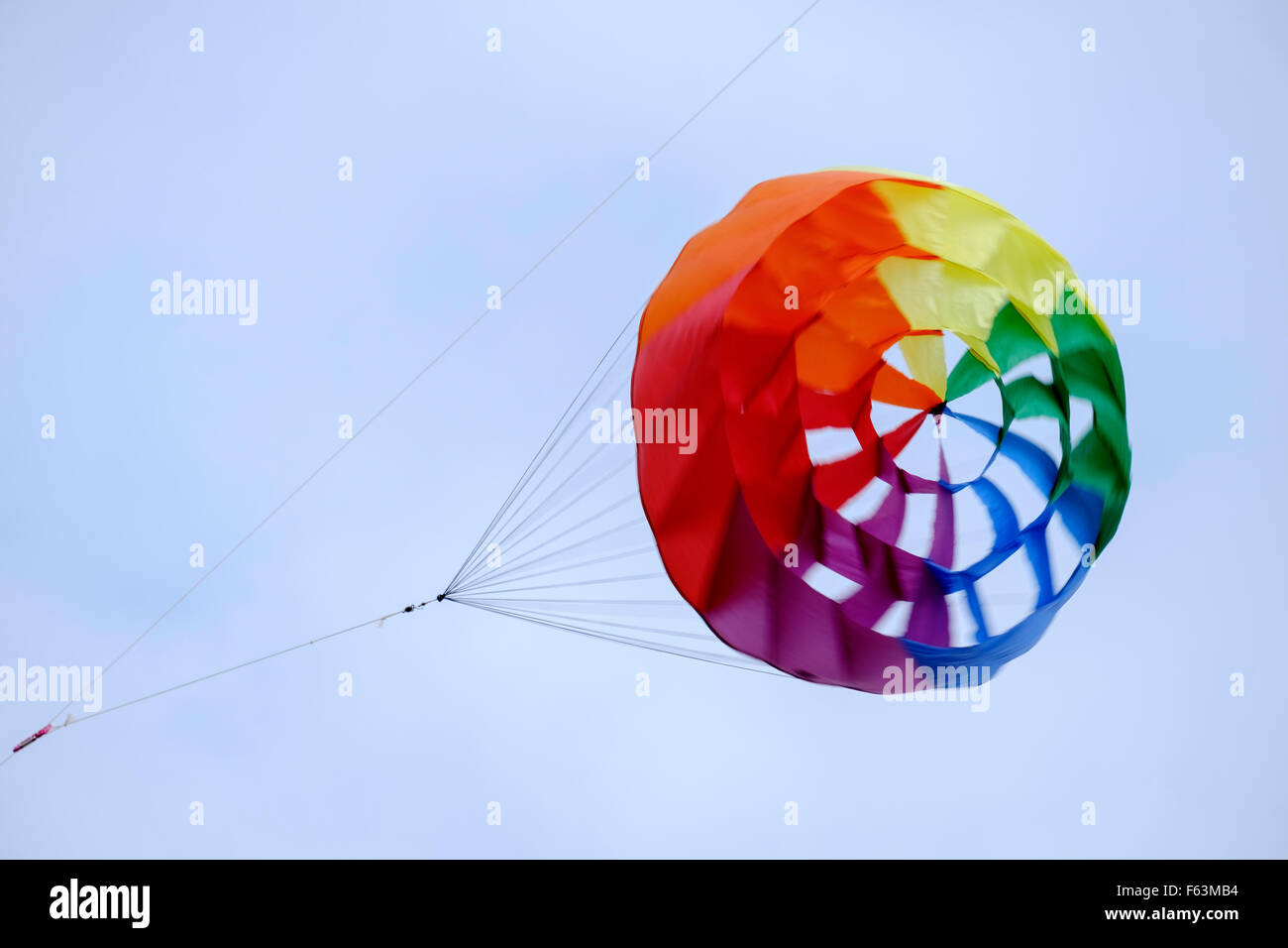 Colourful kite blowing in the wind Stock Photo - Alamy