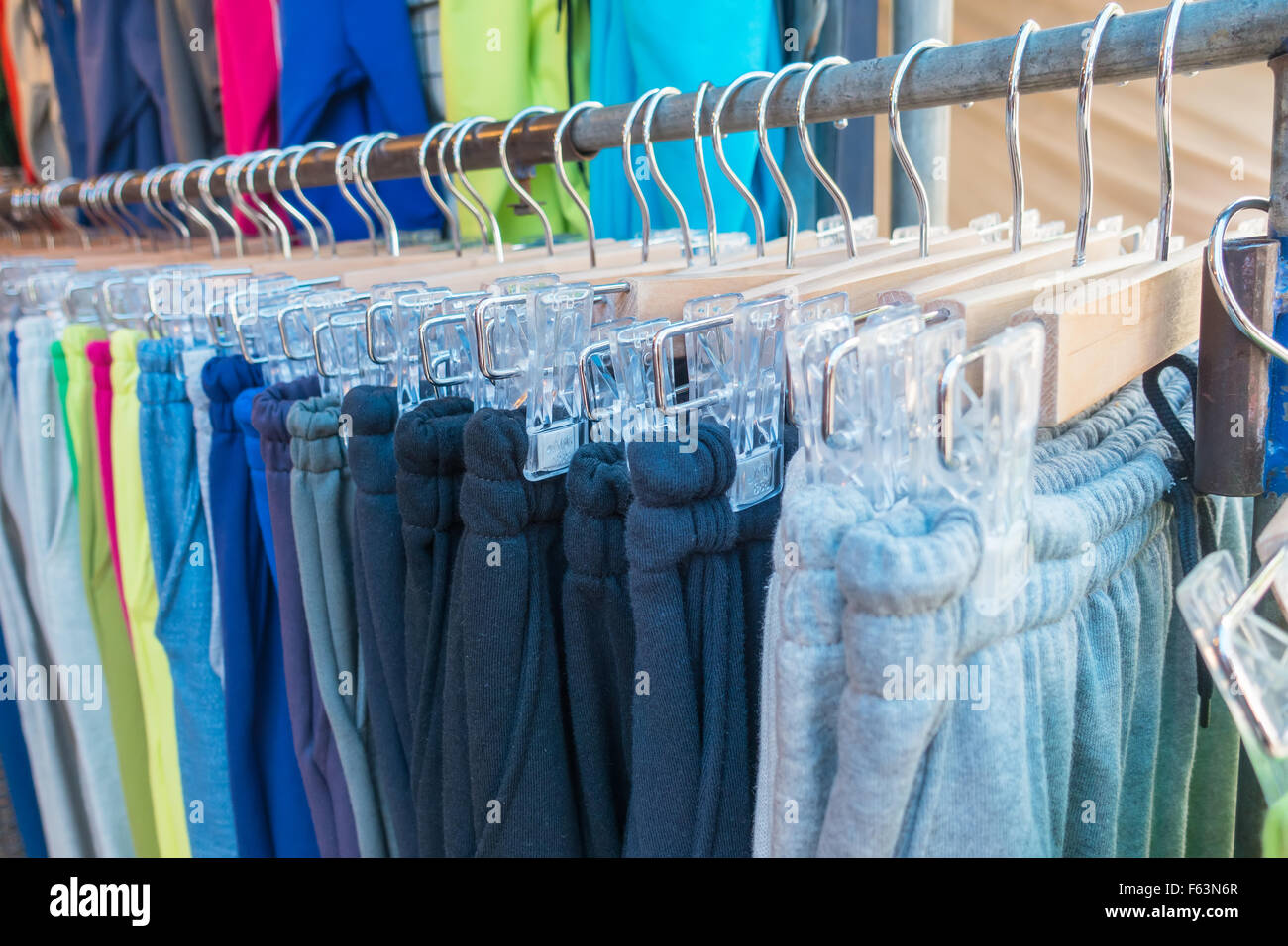 Clothes on hangers in a clothes shop Stock Photo - Alamy