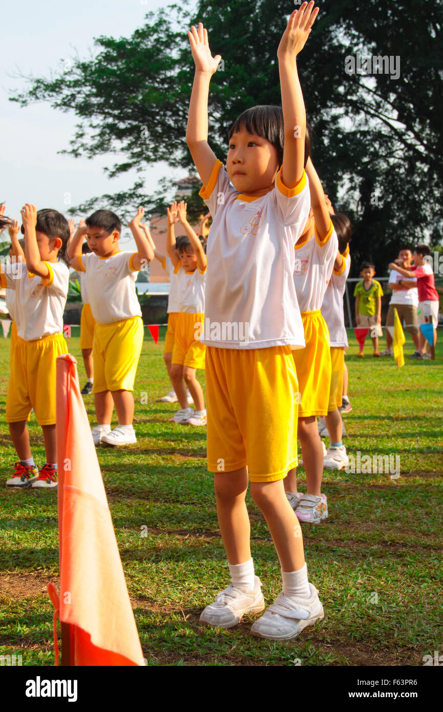 Kindergarten children performing dance at their school sport day Stock ...