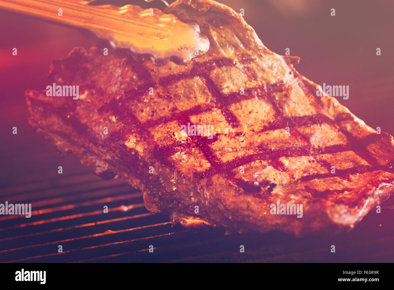 Slice of beef on barbecue grill Stock Photo - Alamy
