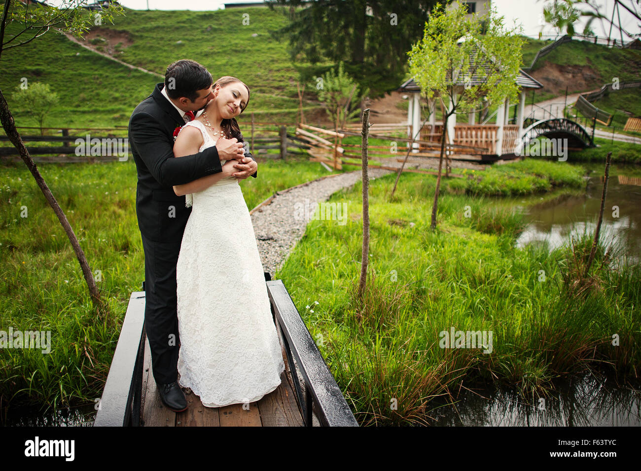 wedding couple at the small bridge Stock Photo - Alamy