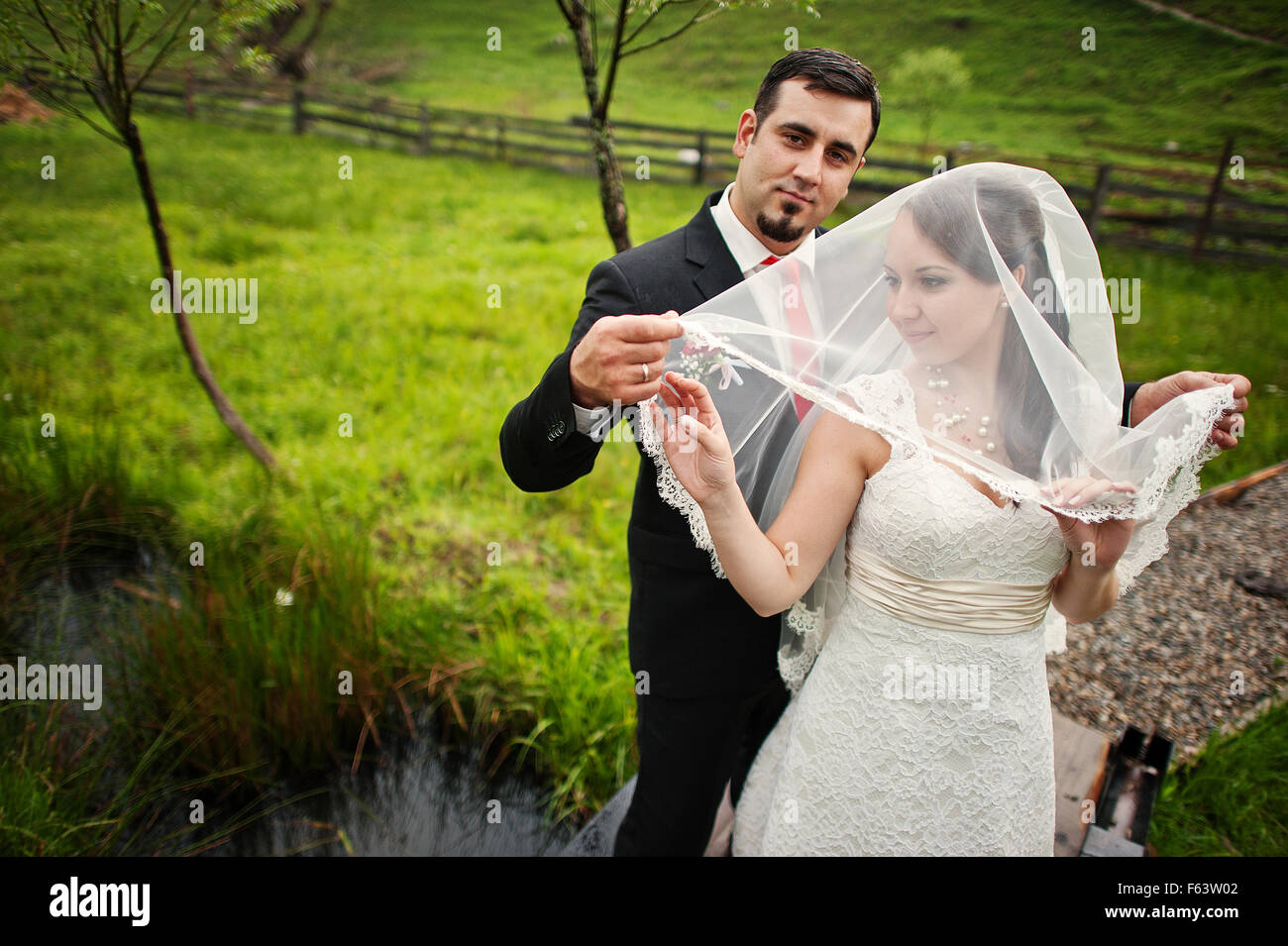 wedding couple at the small bridge Stock Photo - Alamy