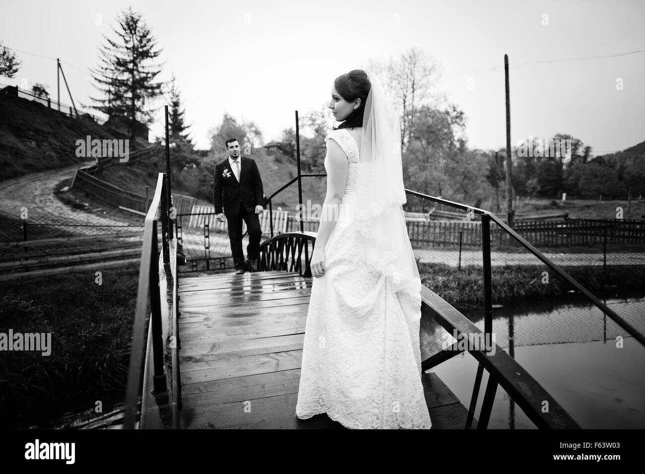 wedding couple at the small bridge Stock Photo - Alamy