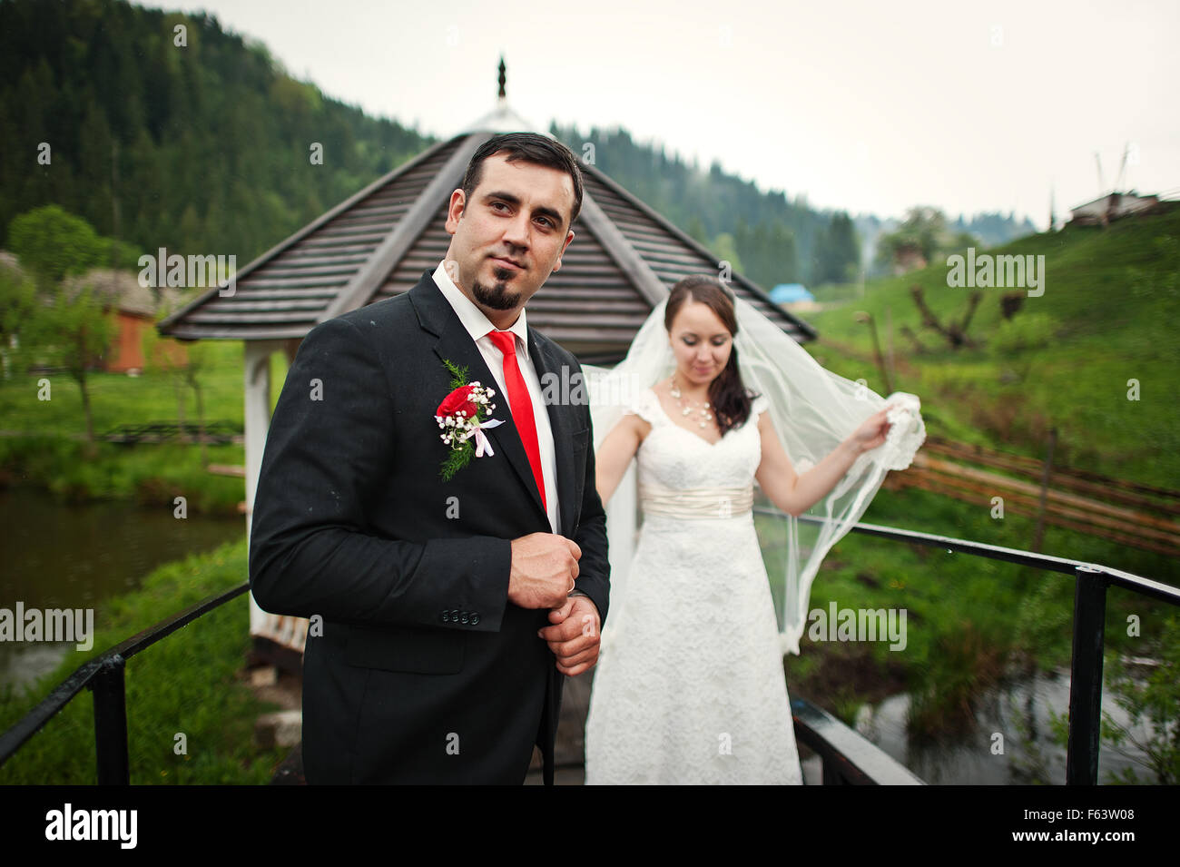 wedding couple at the small bridge Stock Photo - Alamy