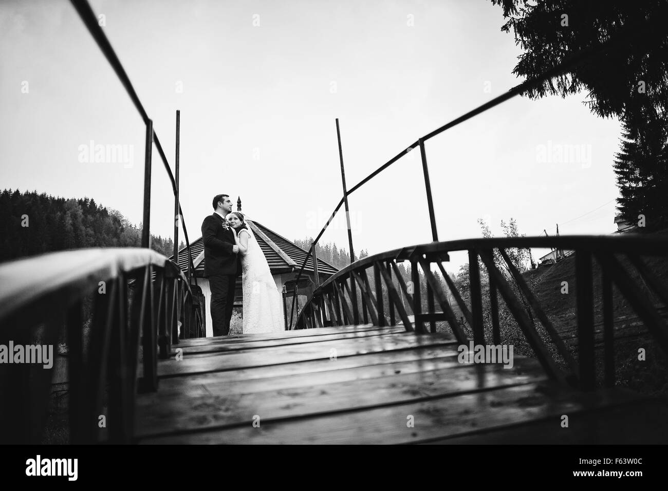 wedding couple at the small bridge Stock Photo - Alamy