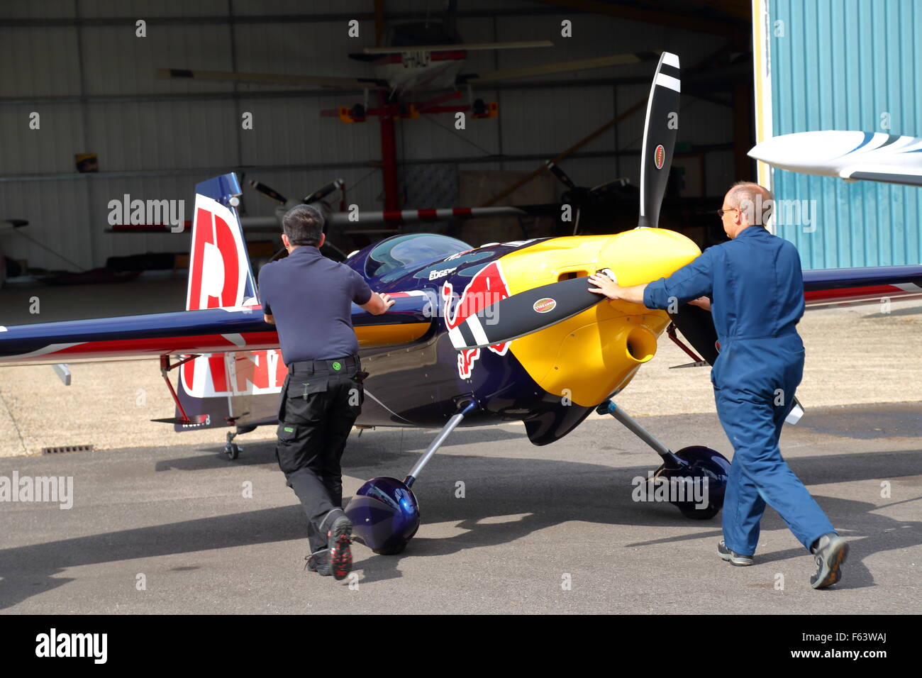 Red Bull Extra 330 being pushed into the Hangar at Booker Stock Photo ...