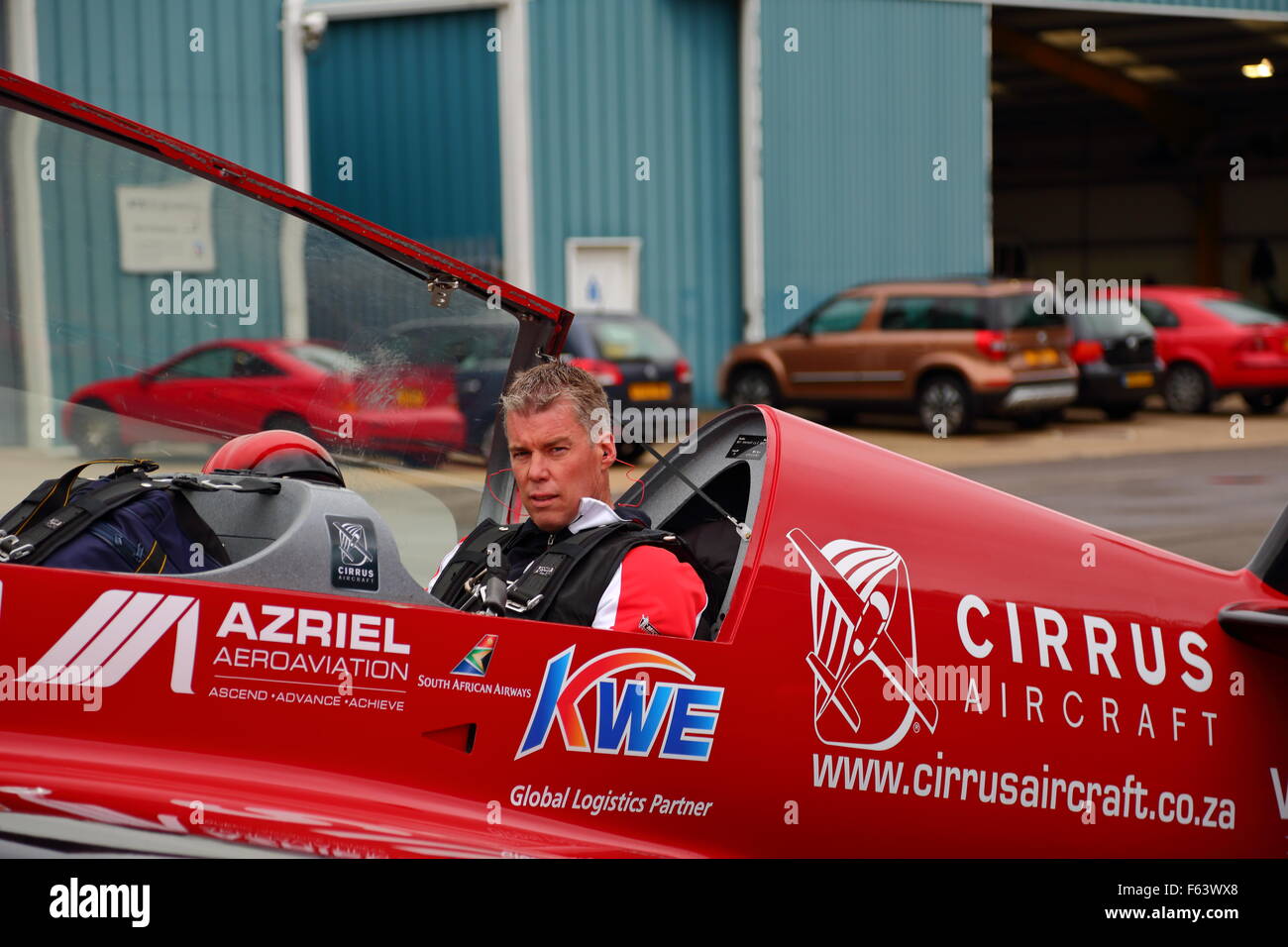 Nigel Hopkins with his red Cirrus airplane preparing for the Red Bull ...