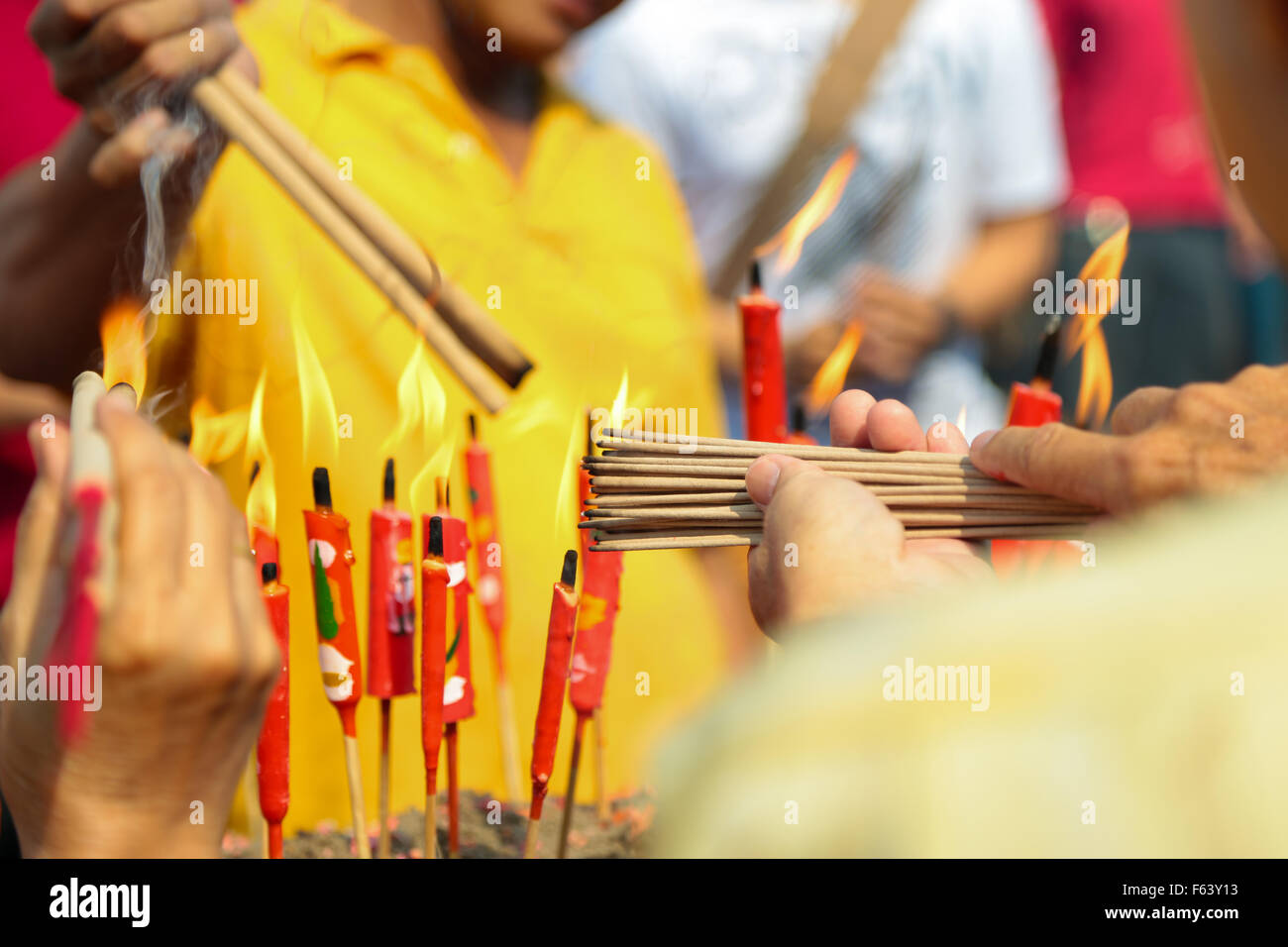 Chinese people lighting up joss sticks at Kwong Tong cemetary, Kuala ...