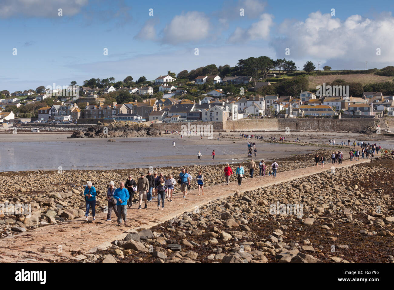 Tourists walking to St Michael's Mount, Cornwall, UK, on the causeway ...