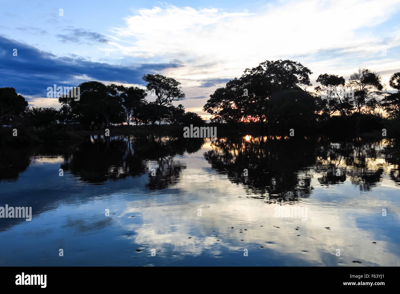 Sunset. Boat Crossing the Amazon. Beni region, Pampas de Yacuma ...