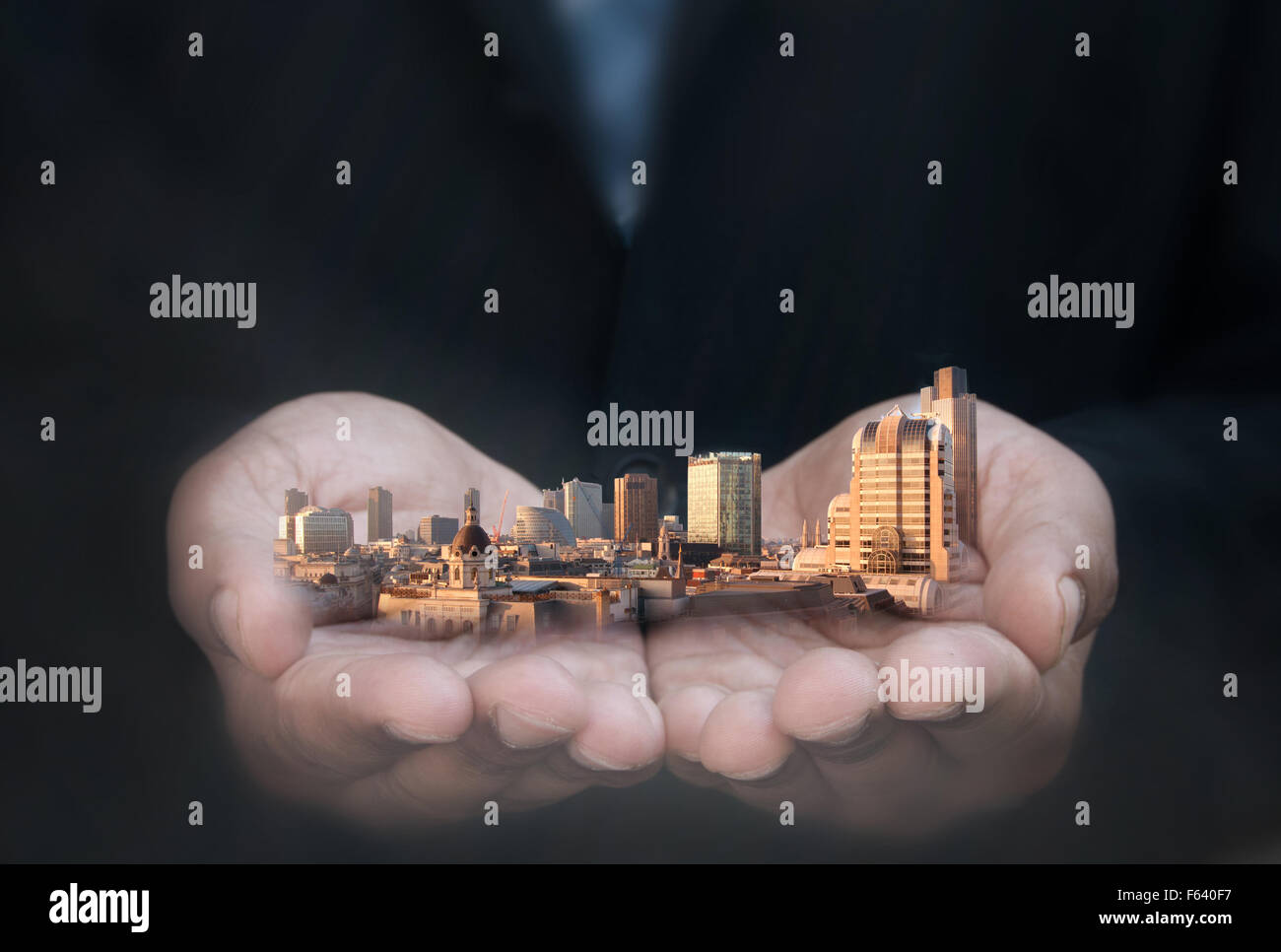 Business man holding city skyline skyscrapers and buildings Stock Photo ...