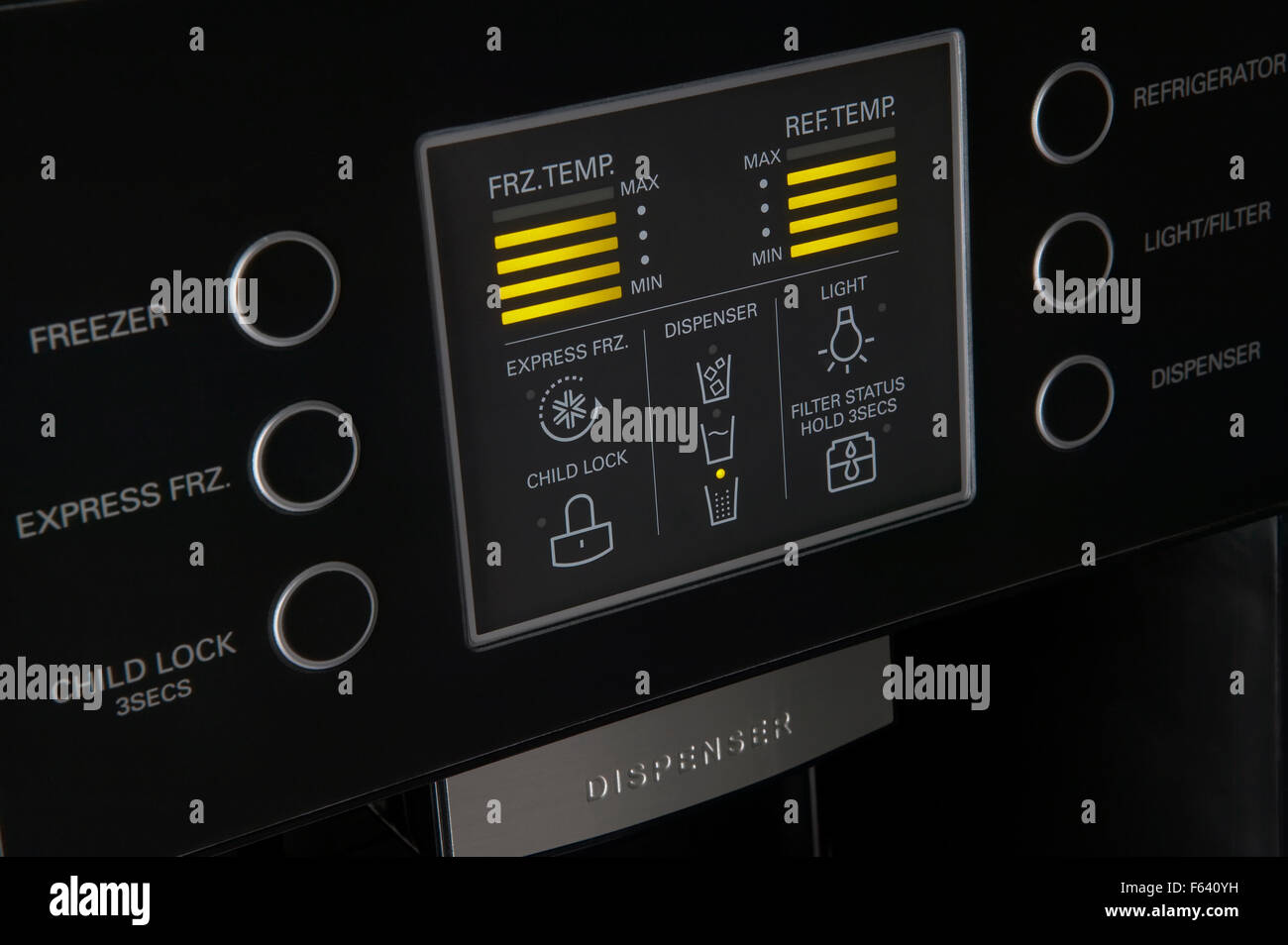 Modern refrigerator display control panel blue tone close up low key ...