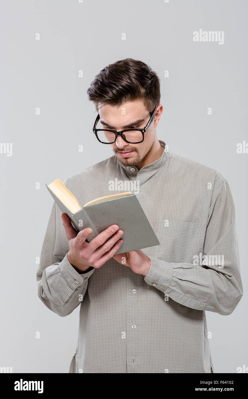 Smart handsome man reading book hi-res stock photography and images - Alamy