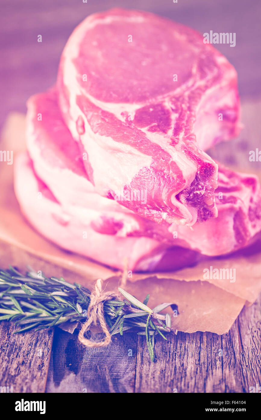 Organic pork lion chops of thick cut with rosemary Stock Photo - Alamy