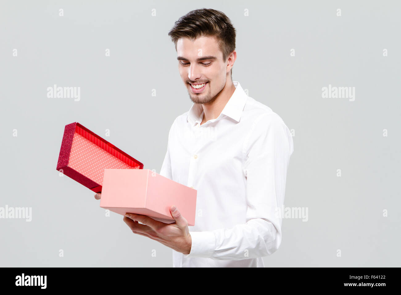 Excited adult opening present hi-res stock photography and images - Alamy