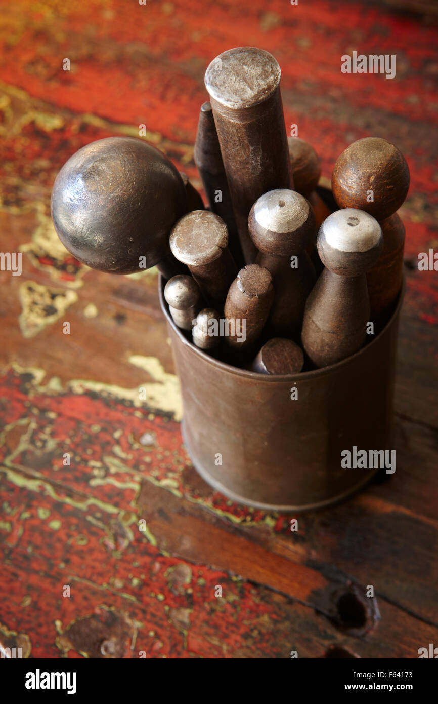 Collection of antique metallic handled tools vertical Stock Photo - Alamy