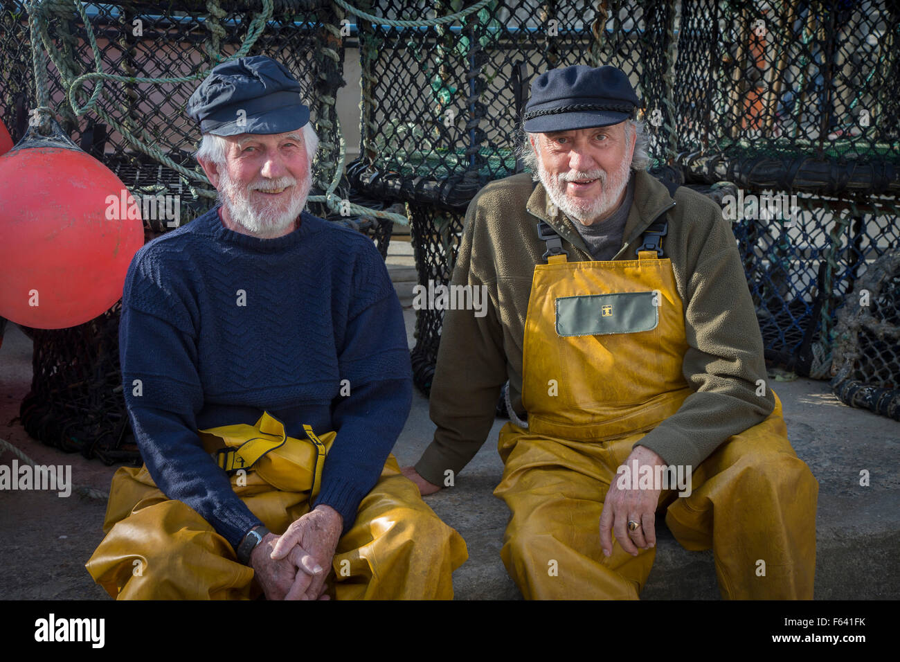 Film Extras waiting while filming Doc Martin at Port Issac fishing and ...