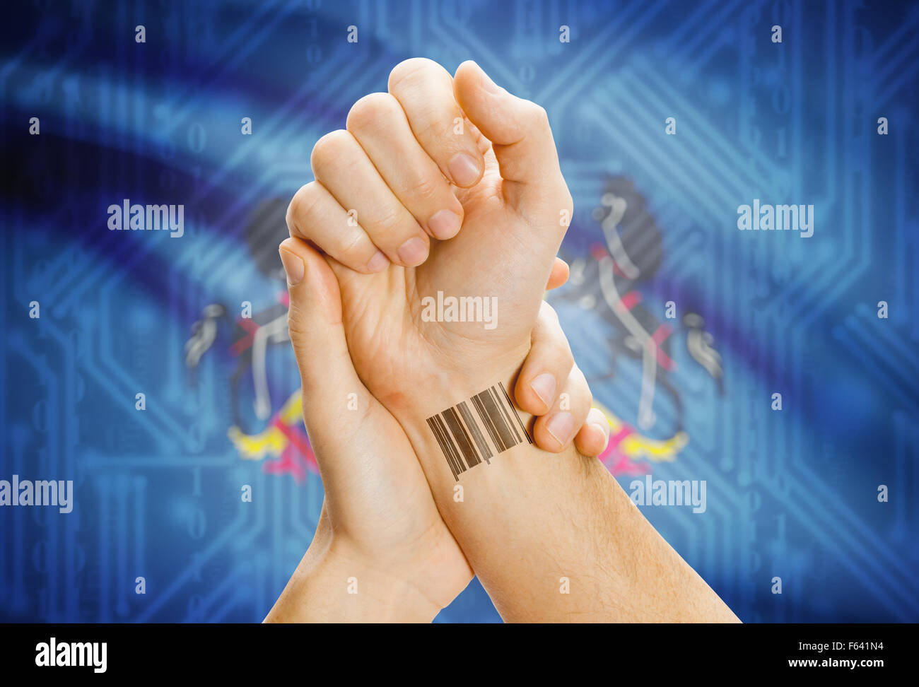 Barcode ID number tatoo on wrist and USA statesl flag on background ...