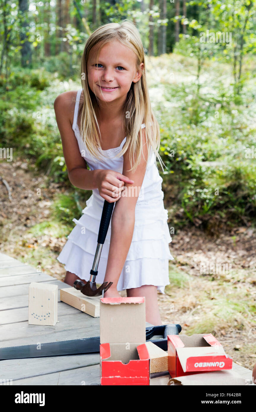 Children trying carpentry Stock Photo - Alamy