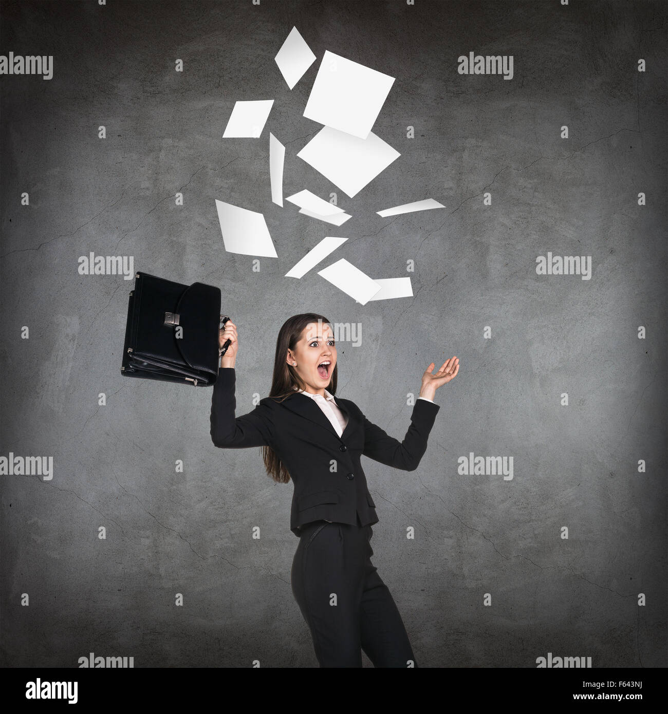 Young business woman throws up paper sheets Stock Photo - Alamy