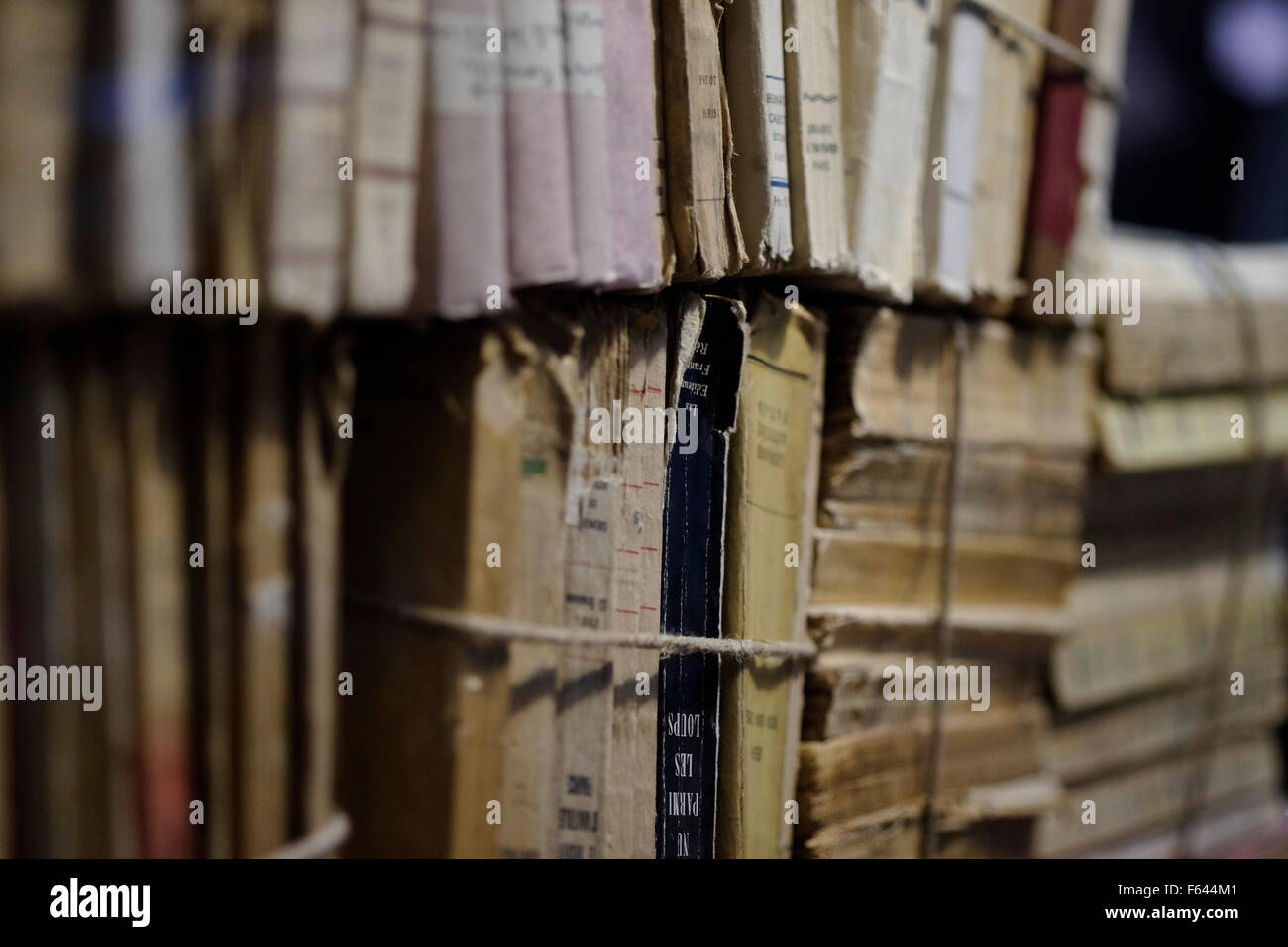 Stack of worn old books wrapped together on a shelf Stock Photo - Alamy