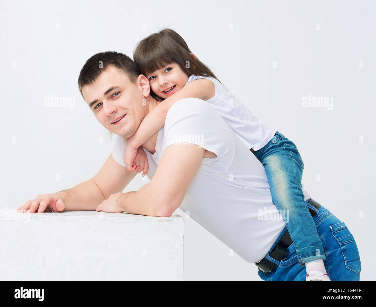 Father with daughter cute studio portrait white background Stock Photo ...