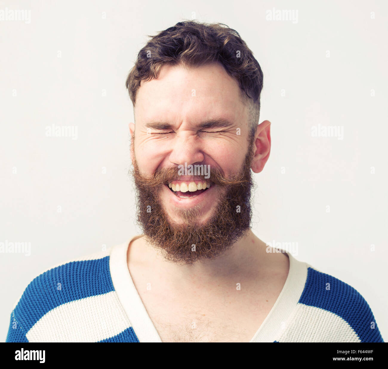 Laugh beard man portrait smiling happy studio portrait Stock Photo - Alamy