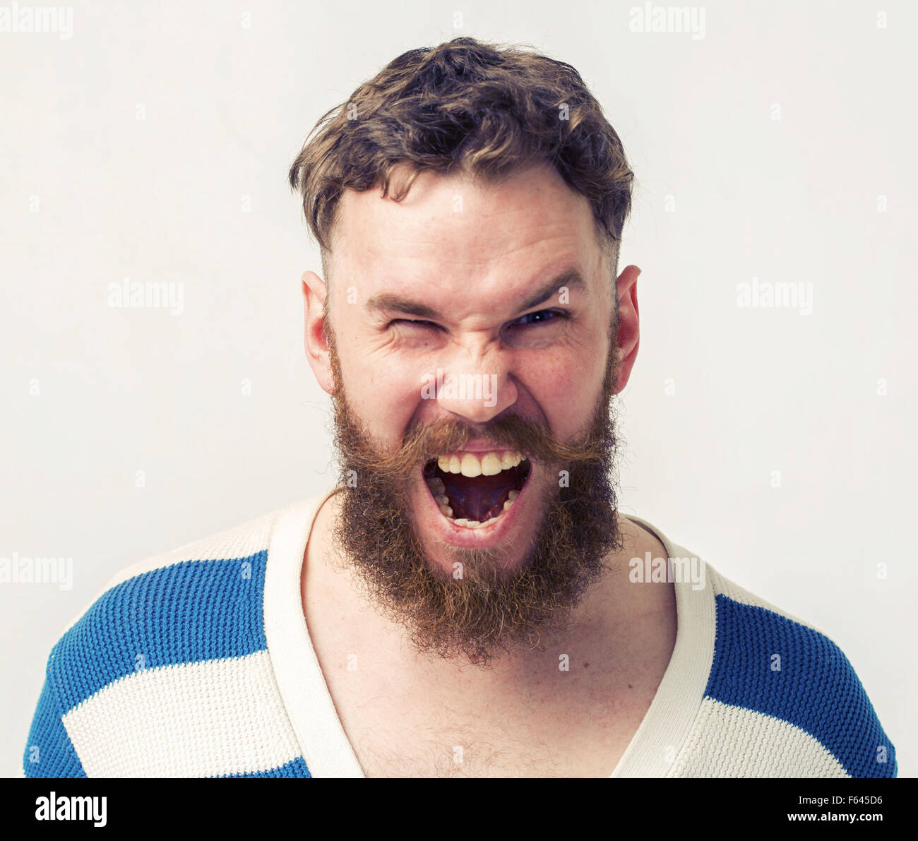 Screaming beard man studio portrait Stock Photo - Alamy