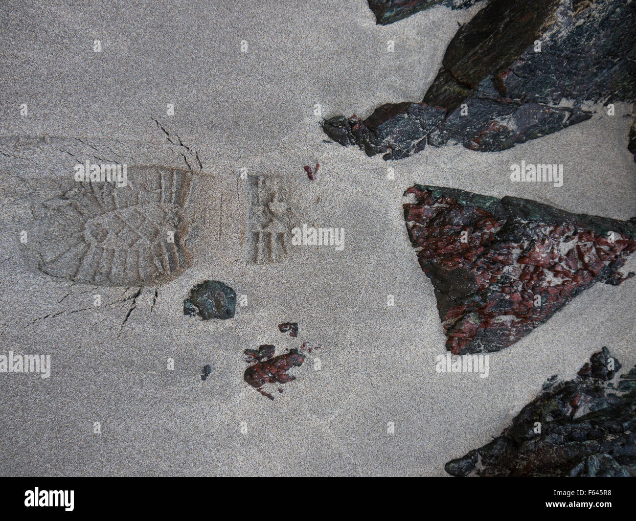 Footprint in sand with sand/ rock background Stock Photo - Alamy