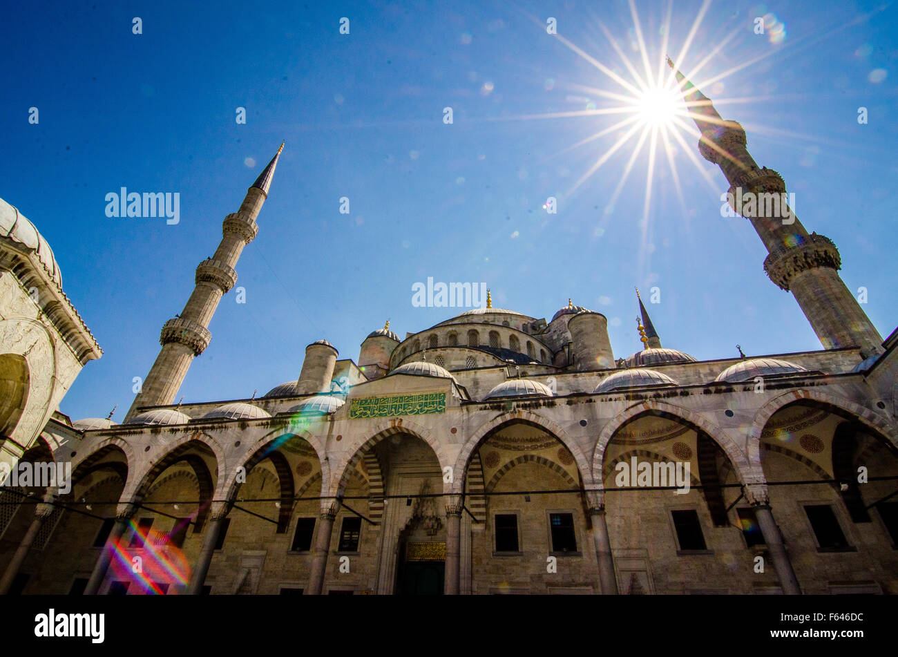 Majestic view of a historic mosque under a clear sky with sunlight ...