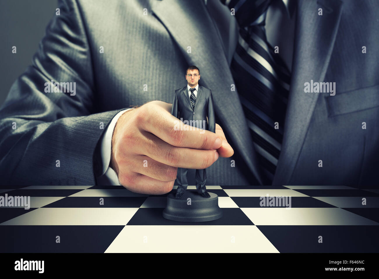 Big boss playing chess using businessman Stock Photo - Alamy