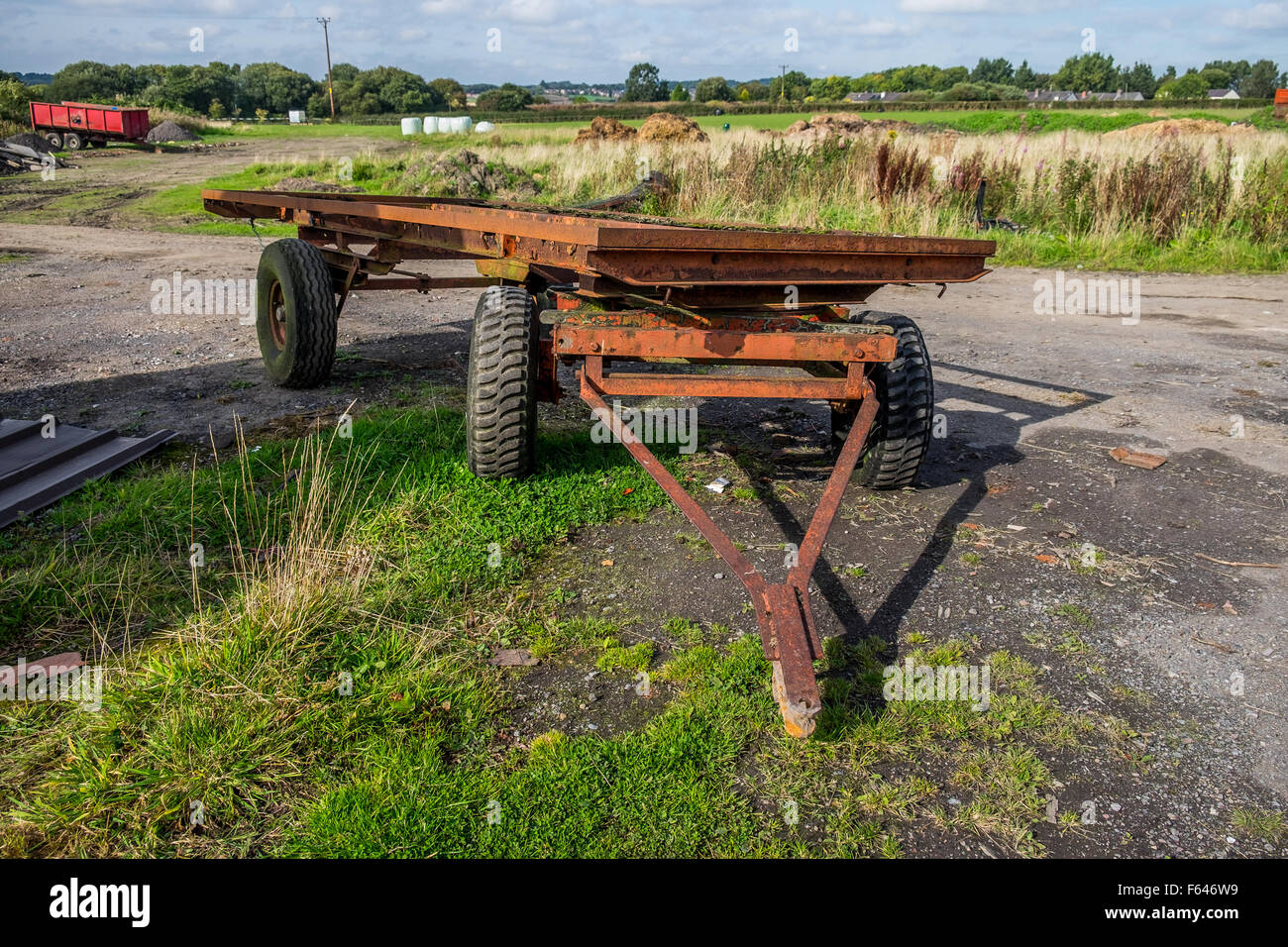 Rusty agricultural trailer abandoned in a farmyard Stock Photo - Alamy