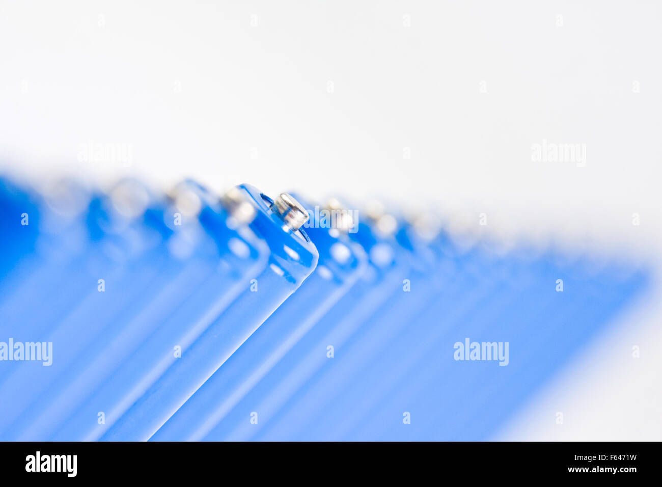 Row of blue batteries Stock Photo - Alamy