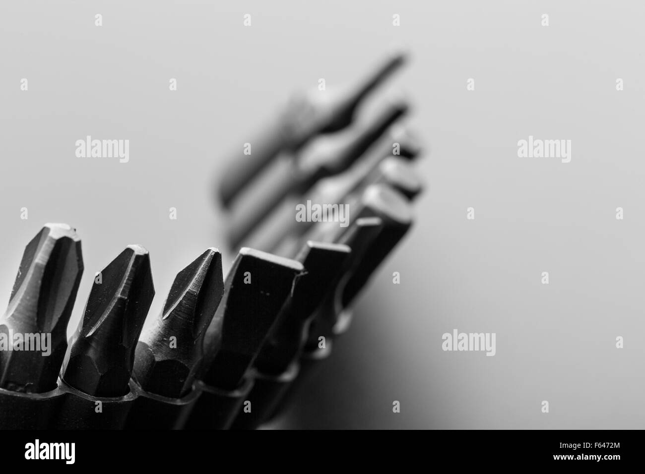 Closeup of screwdriver bits on grey Stock Photo - Alamy