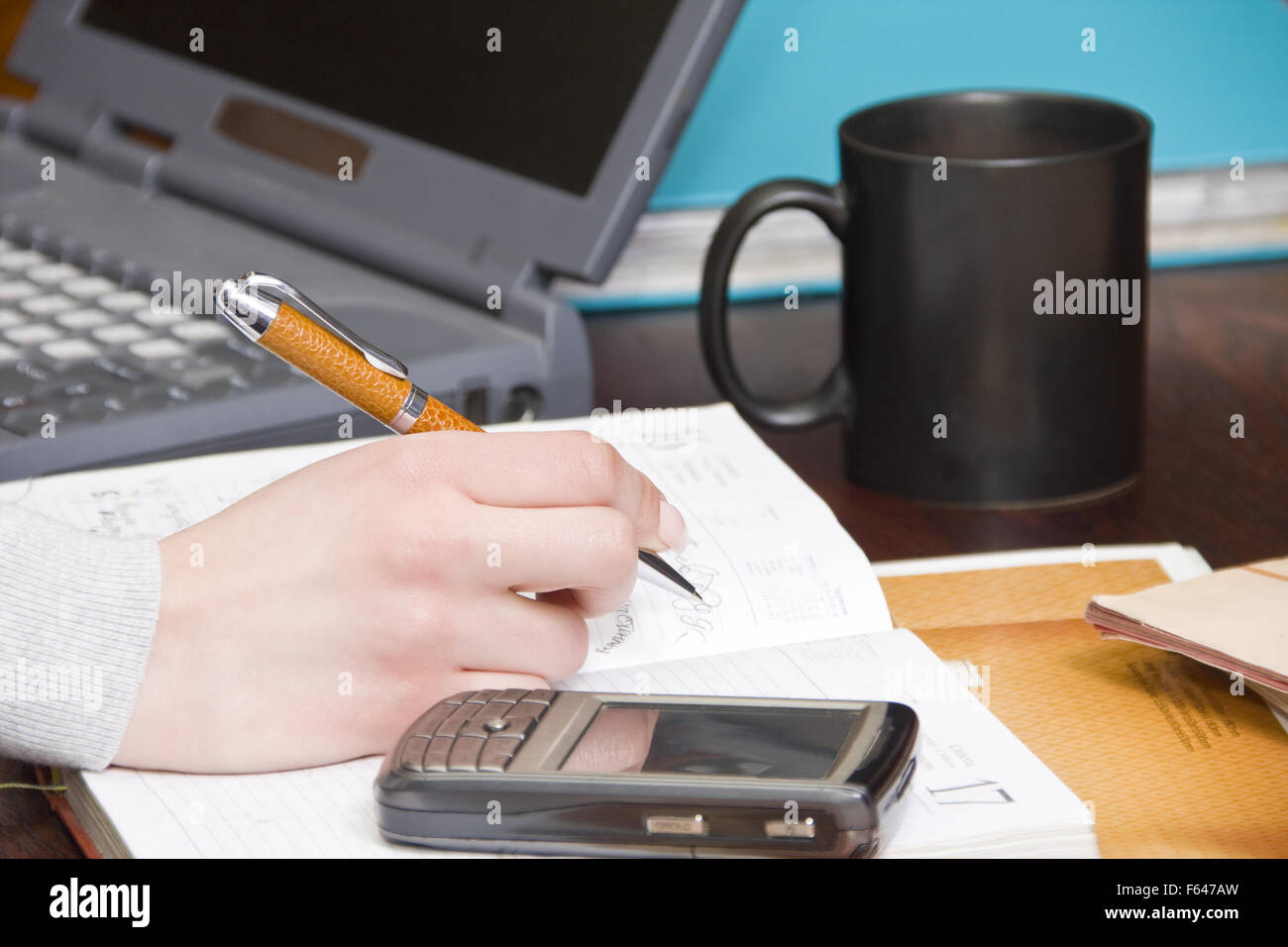 Woman's hand. Everyday office work Stock Photo - Alamy