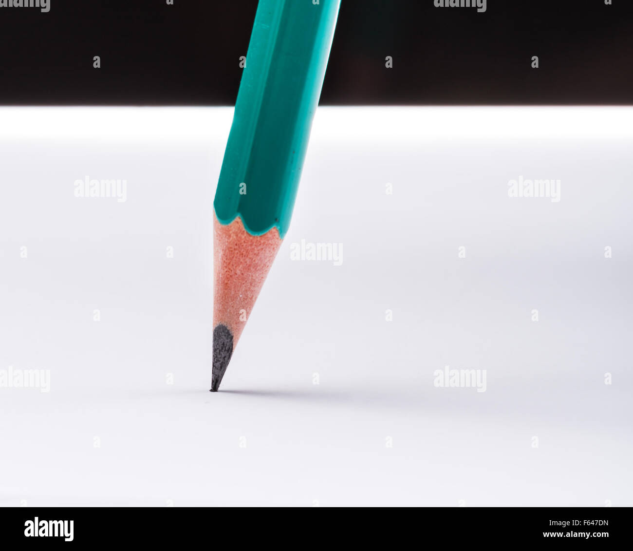 Sharp pencil on white paper Stock Photo - Alamy
